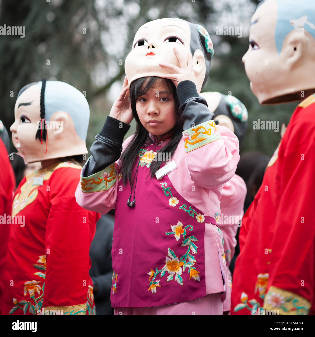 Paris, France - Feb 6, 2011: Chinese young woman removing her mask at ...