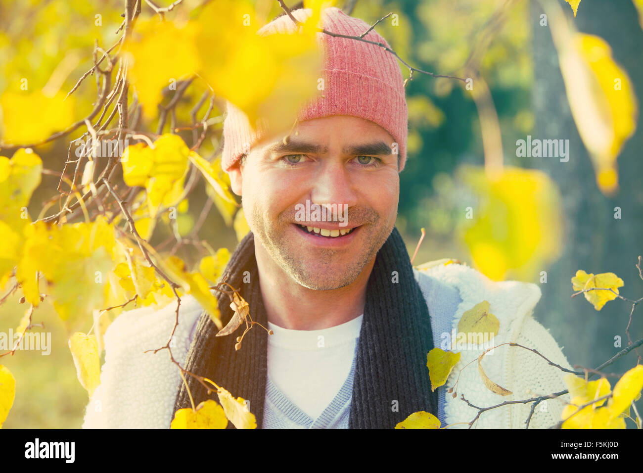 portrait of a man by a tree in fall Stock Photo - Alamy