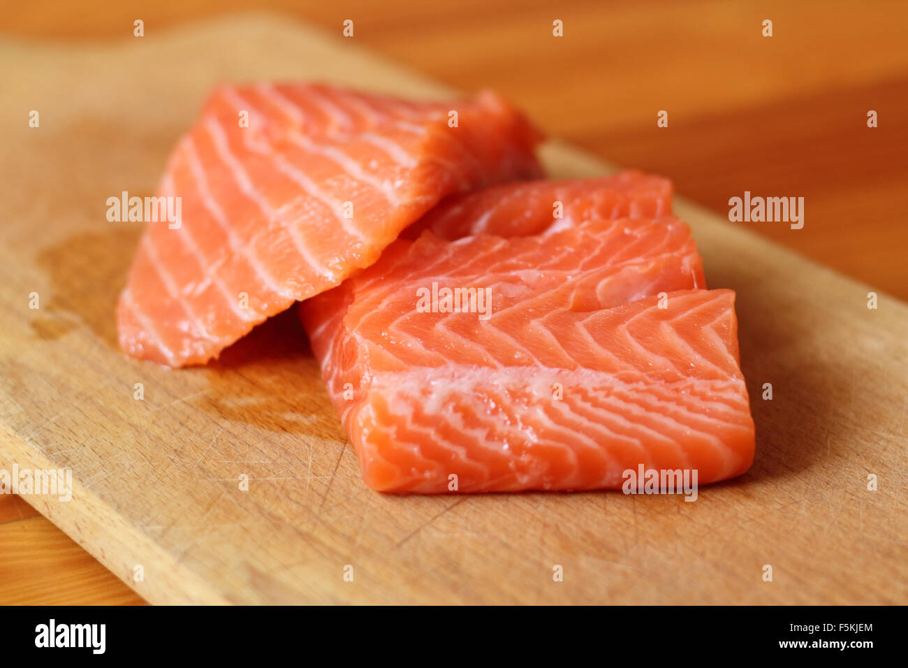Raw Humpback Salmon Fillet on cutting board (soft focus Stock Photo - Alamy