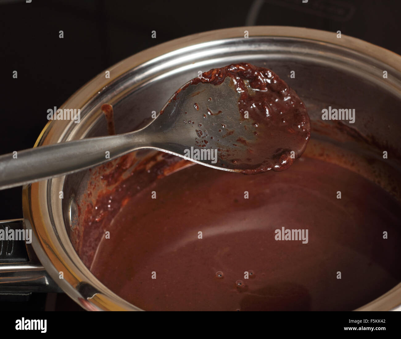 A chef mixing chocolate cream. Making Chocolate Cream. Series Stock ...