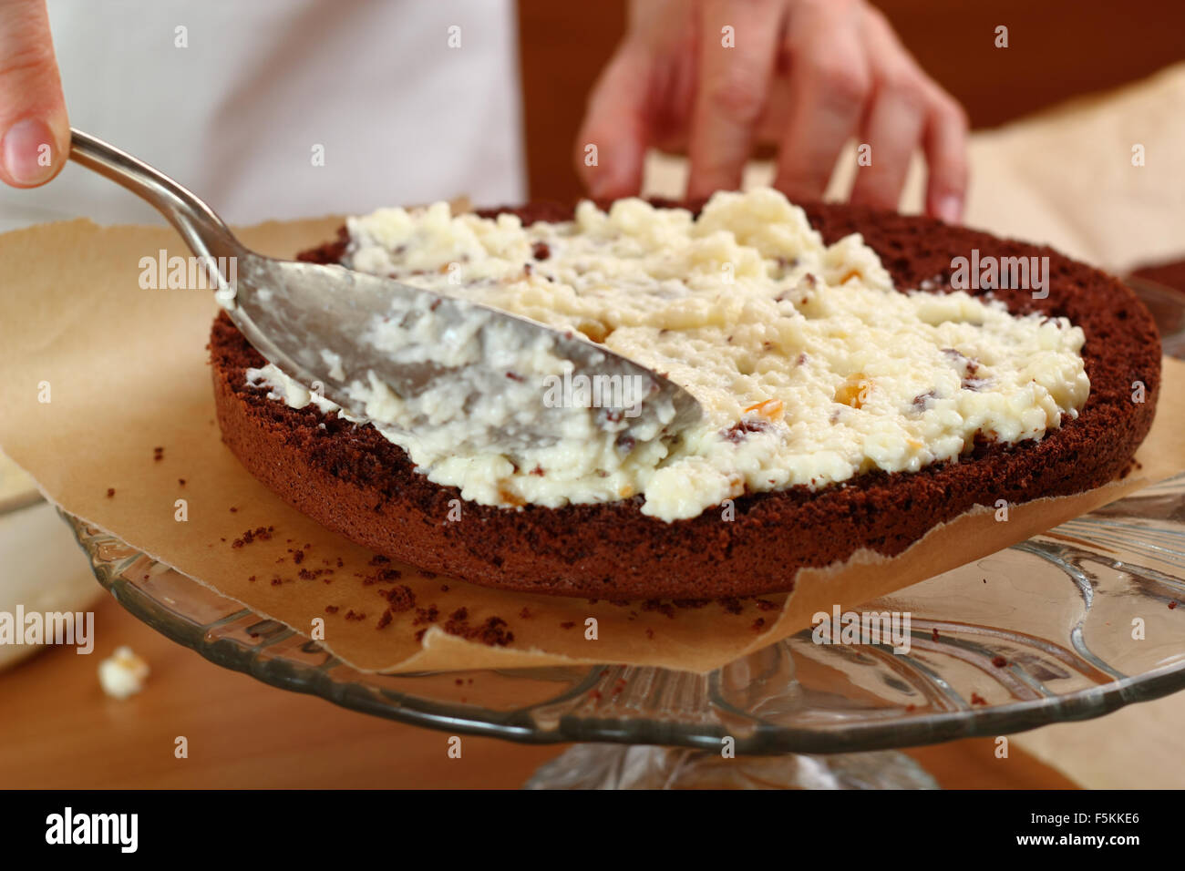 Filling and Stacking Layers. Making Chocolate Layer Cake. Series Stock ...