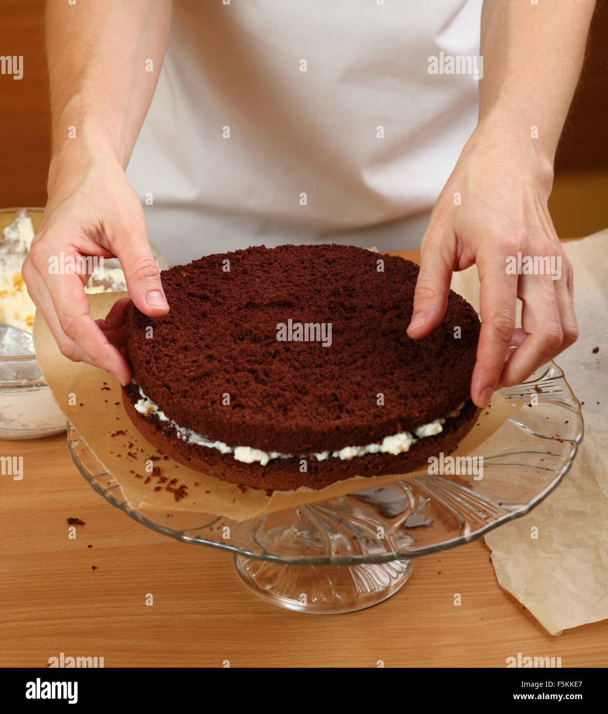 Filling and Stacking Layers. Making Chocolate Layer Cake. Series Stock ...