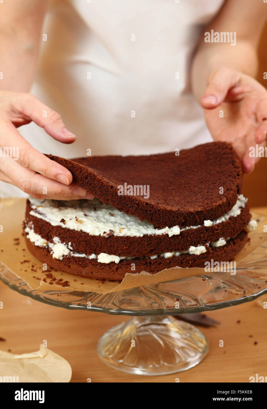 Filling and Stacking Layers. Making Chocolate Layer Cake. Series Stock ...