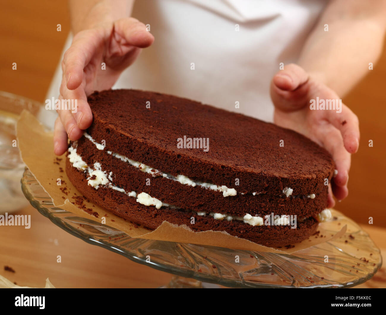 Filling and Stacking Layers. Making Chocolate Layer Cake. Series Stock ...
