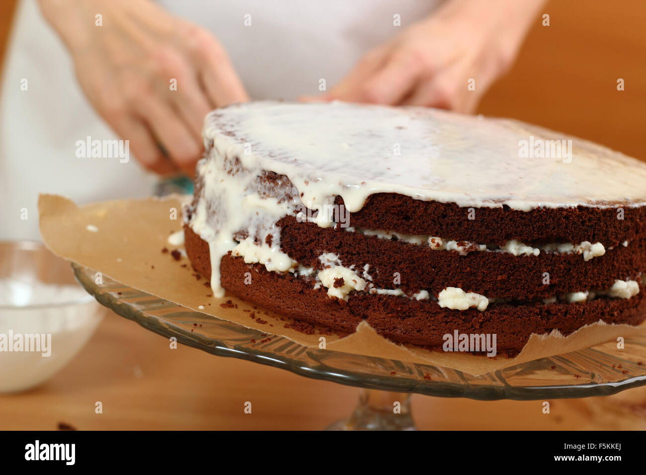 Pouring frosting on Cake. Making Chocolate Layer Cake. Series Stock ...
