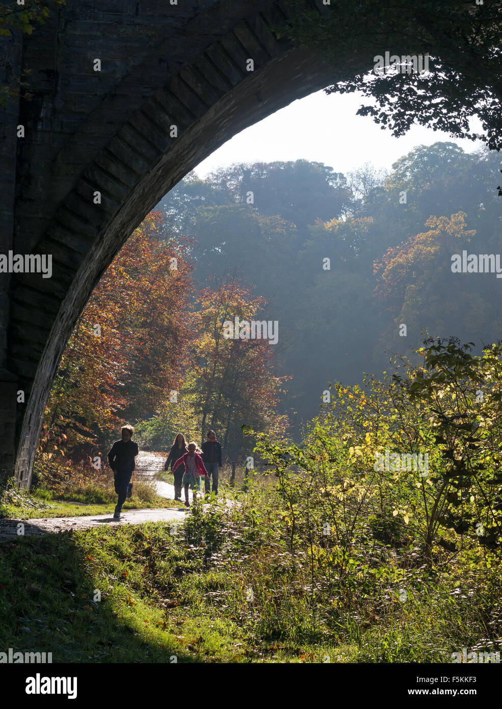 Family walking along the riverside path in Durham City, England, UK ...