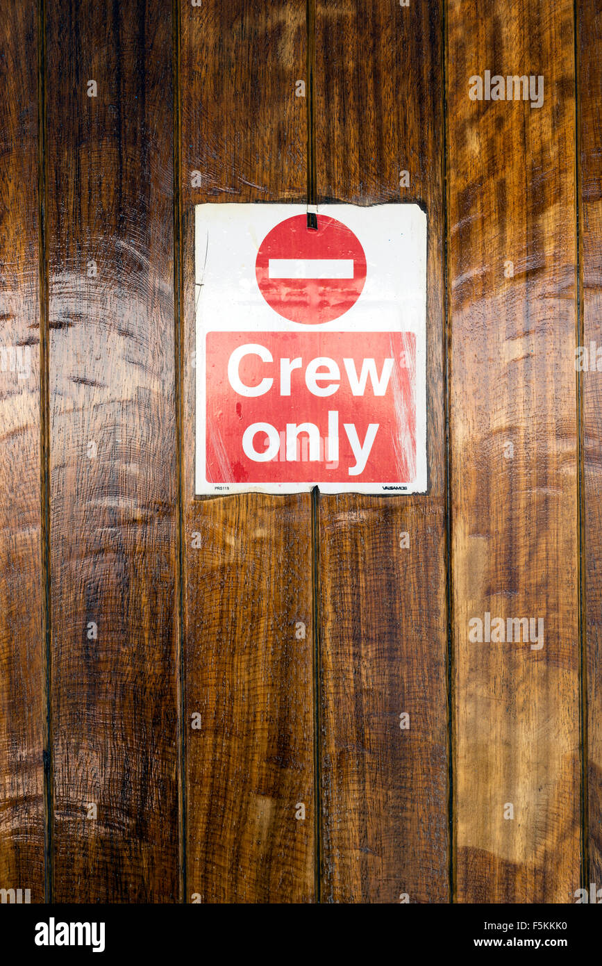 A door with a Crew Only sign posted Stock Photo - Alamy