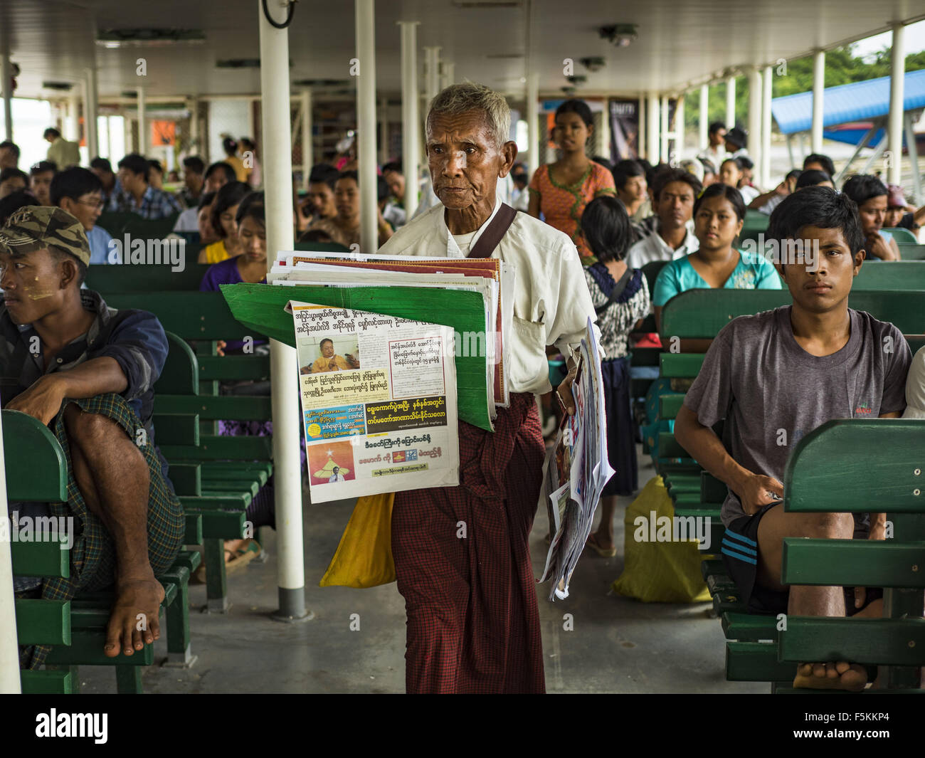 Yangon, Yangon Division, Myanmar. 30th Oct, 2015. A newspaper vendor on ...