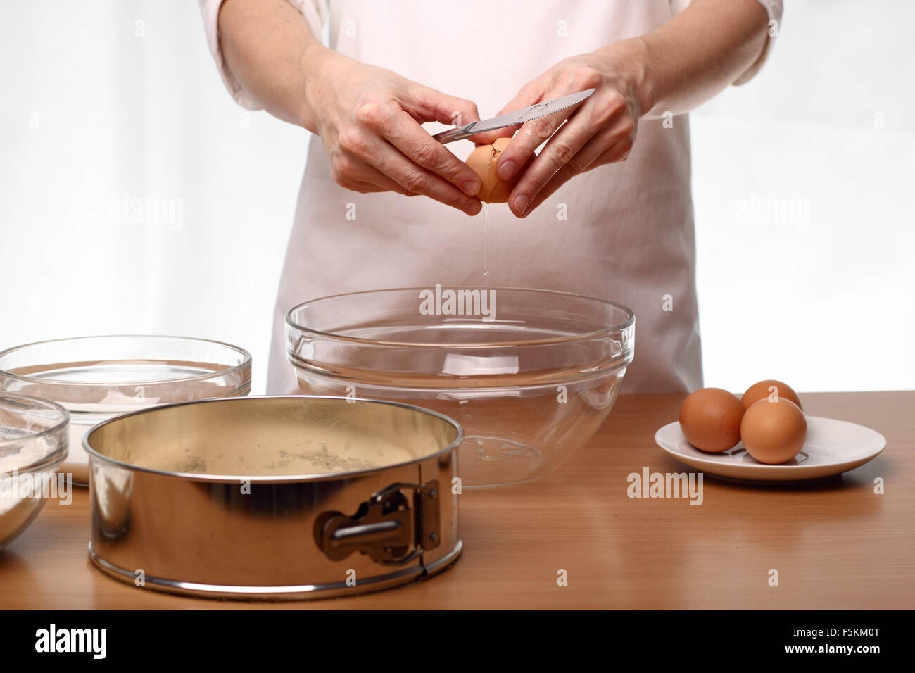 Baker cracking egg making victoria hi-res stock photography and images ...