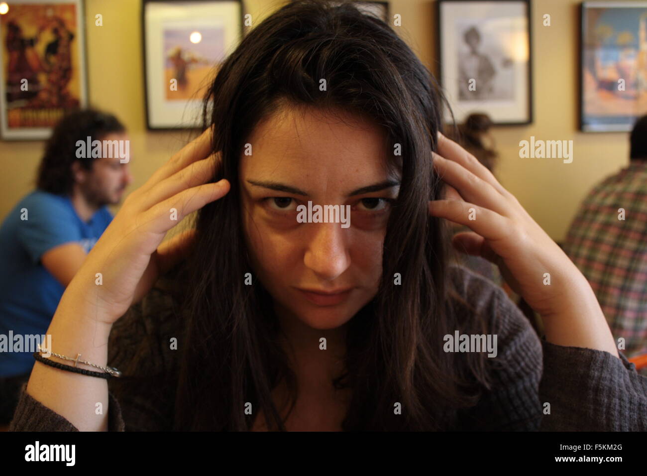 Greek woman in a cafe staring intensely at the camera Stock Photo - Alamy
