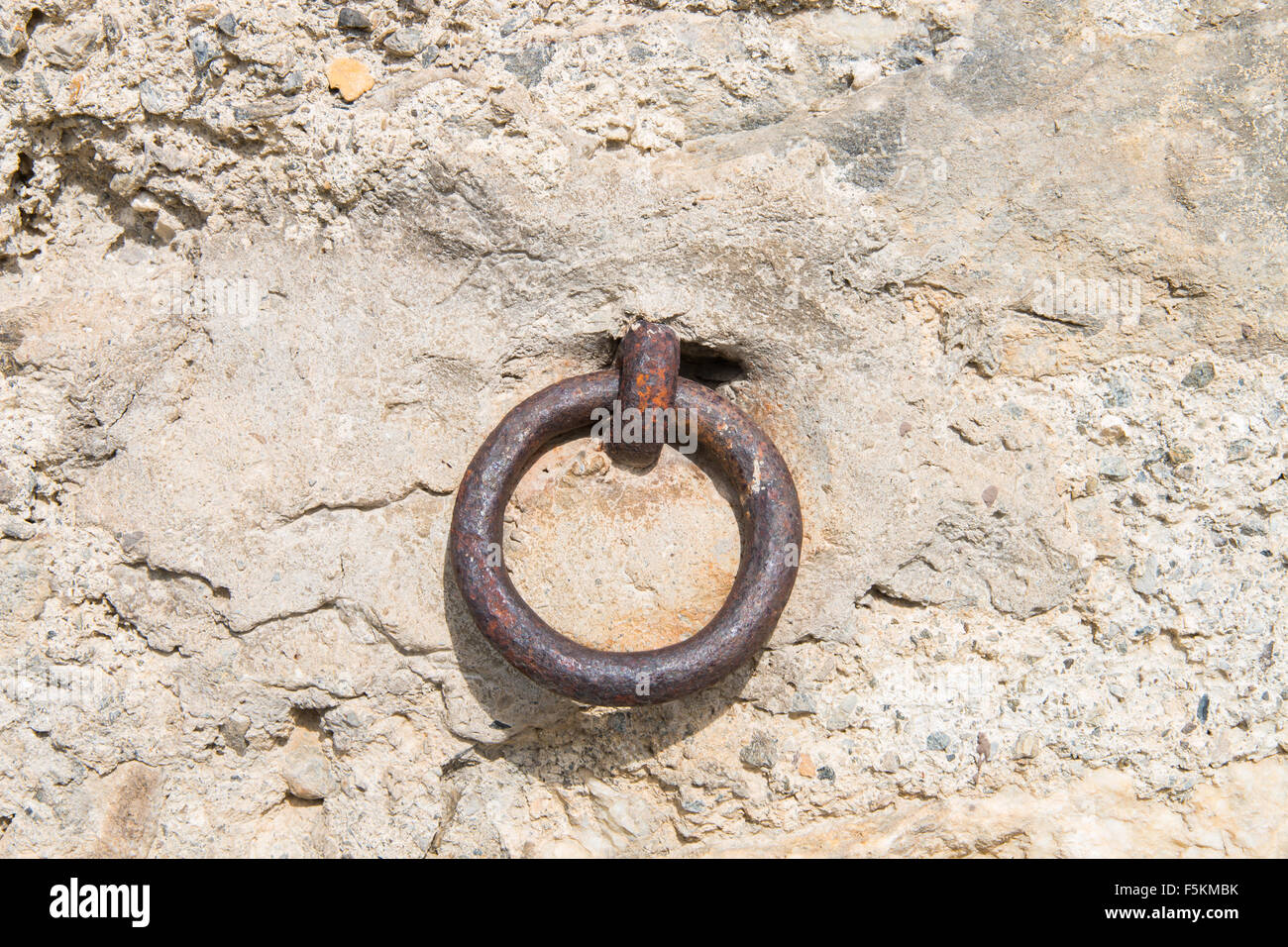 Animals Tie iron rusted Ring on a wall of an old mountain stable made ...
