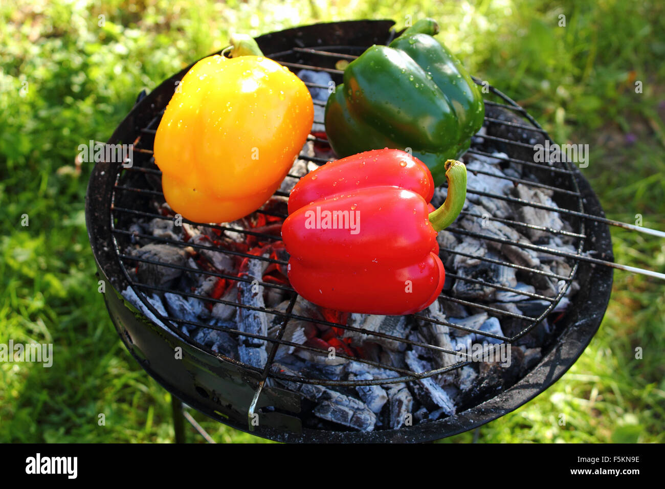 Grilling bell peppers on barbecue grill Stock Photo - Alamy