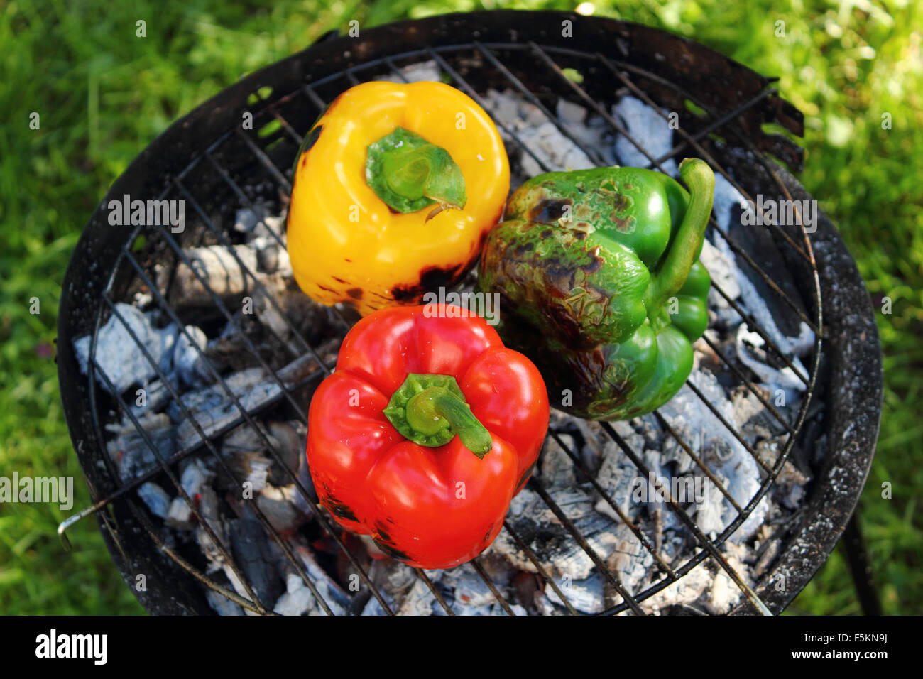 Grilling bell peppers on barbecue grill Stock Photo - Alamy