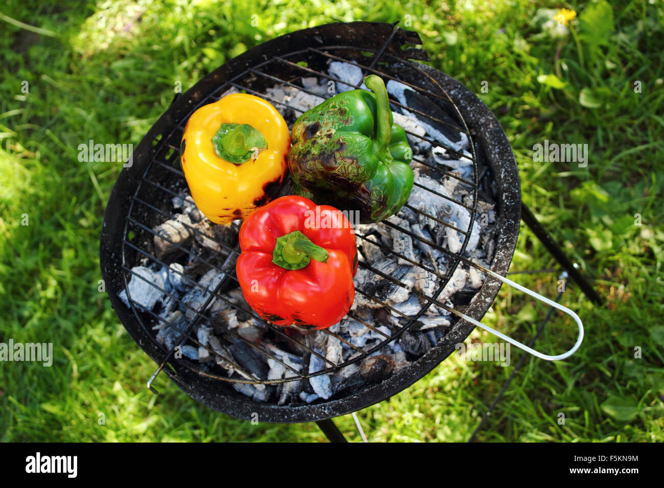 Grilling bell peppers on barbecue grill Stock Photo - Alamy