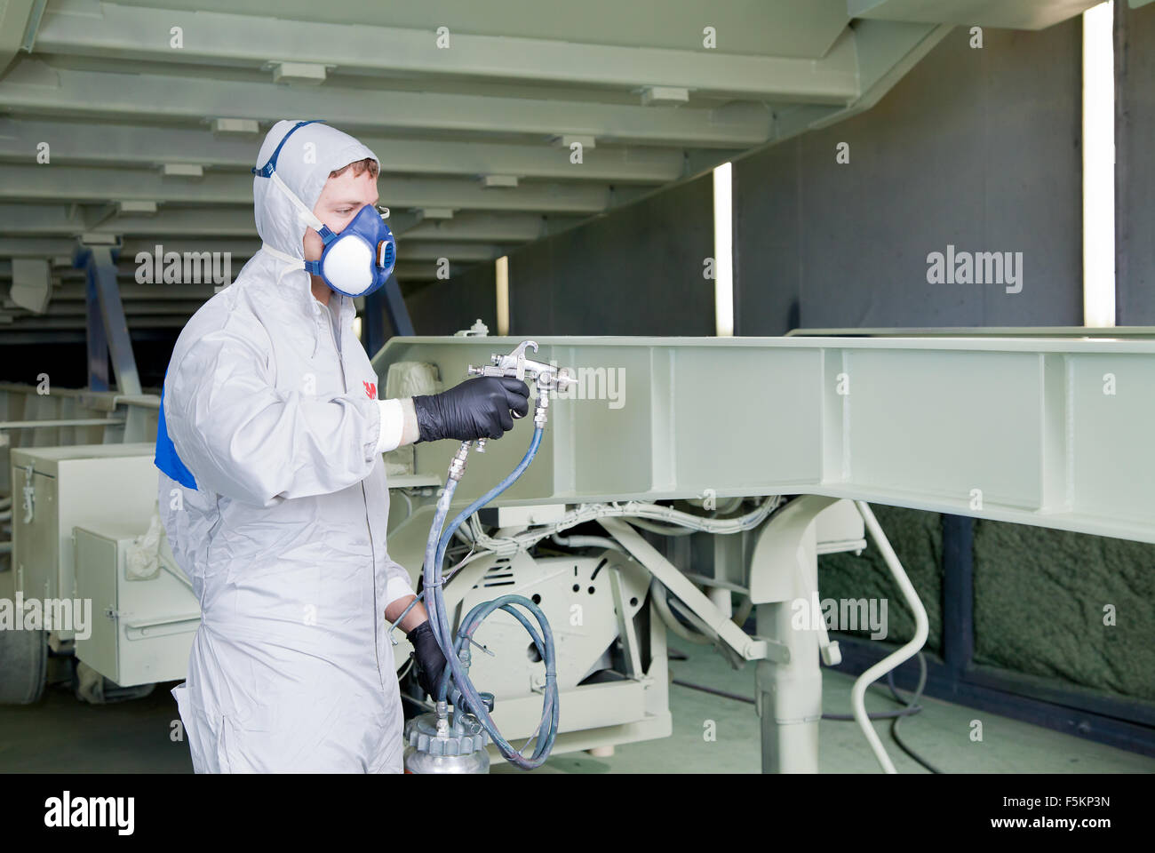 Paint spraying a unit Stock Photo - Alamy