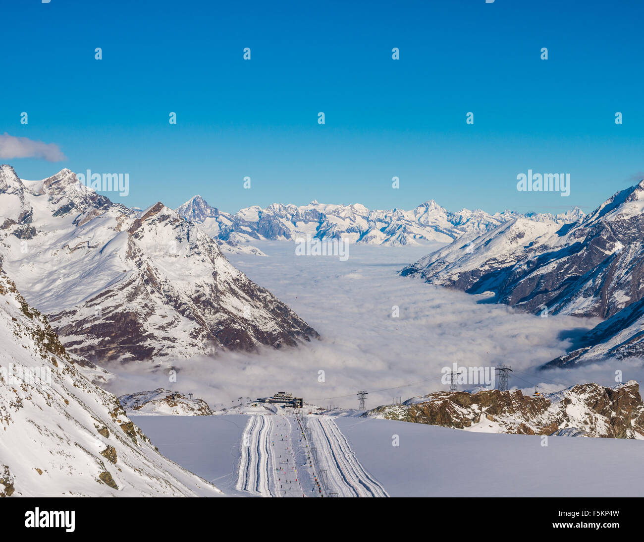 Ski piste and valley with fog - Zermatt, Switzerland Stock Photo - Alamy