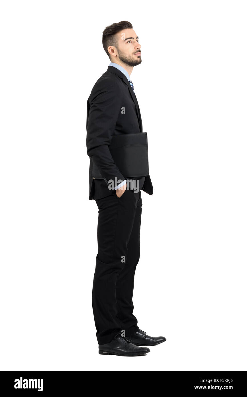 Young confident businessman holding documents folders looking away side ...
