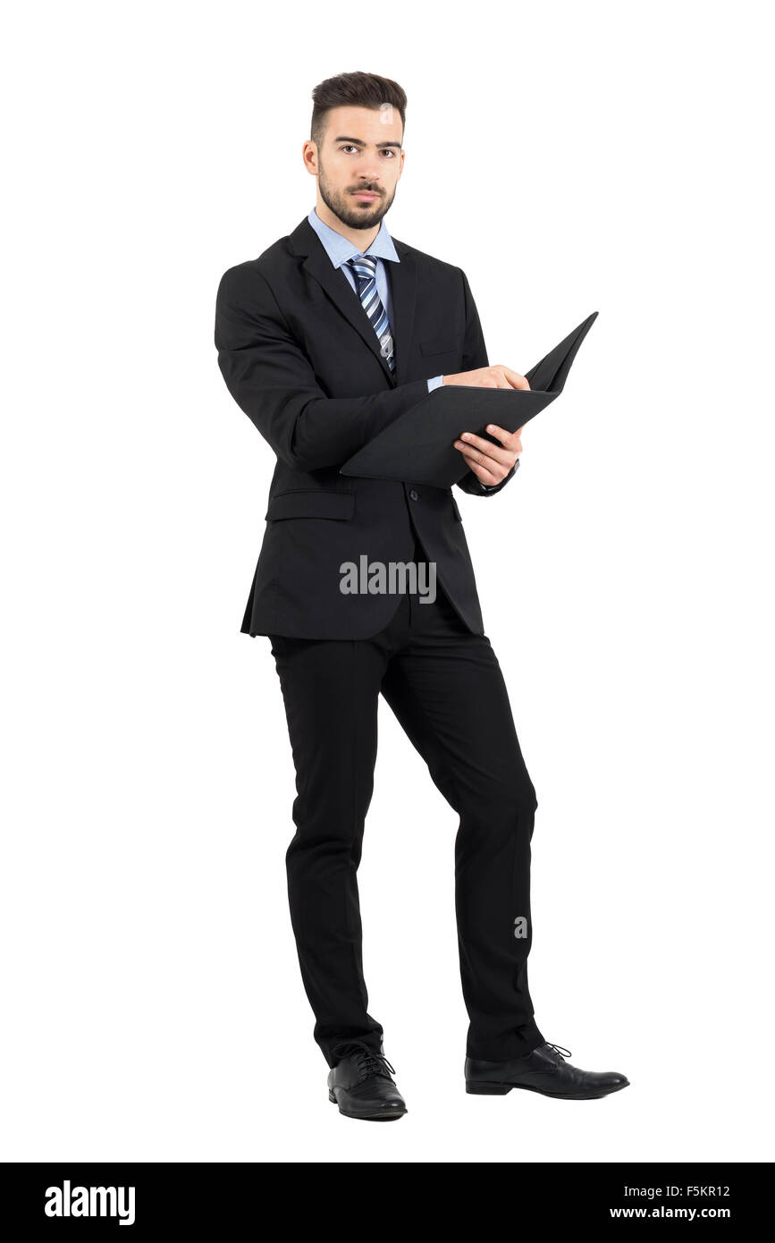 Confident young manager holding business files with paperwork. Full ...