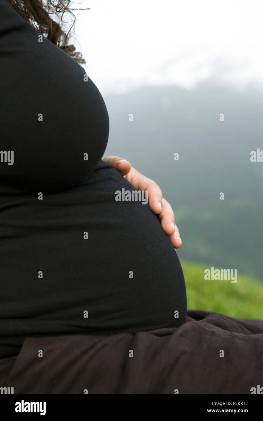 Hand on stomach hi-res stock photography and images - Alamy