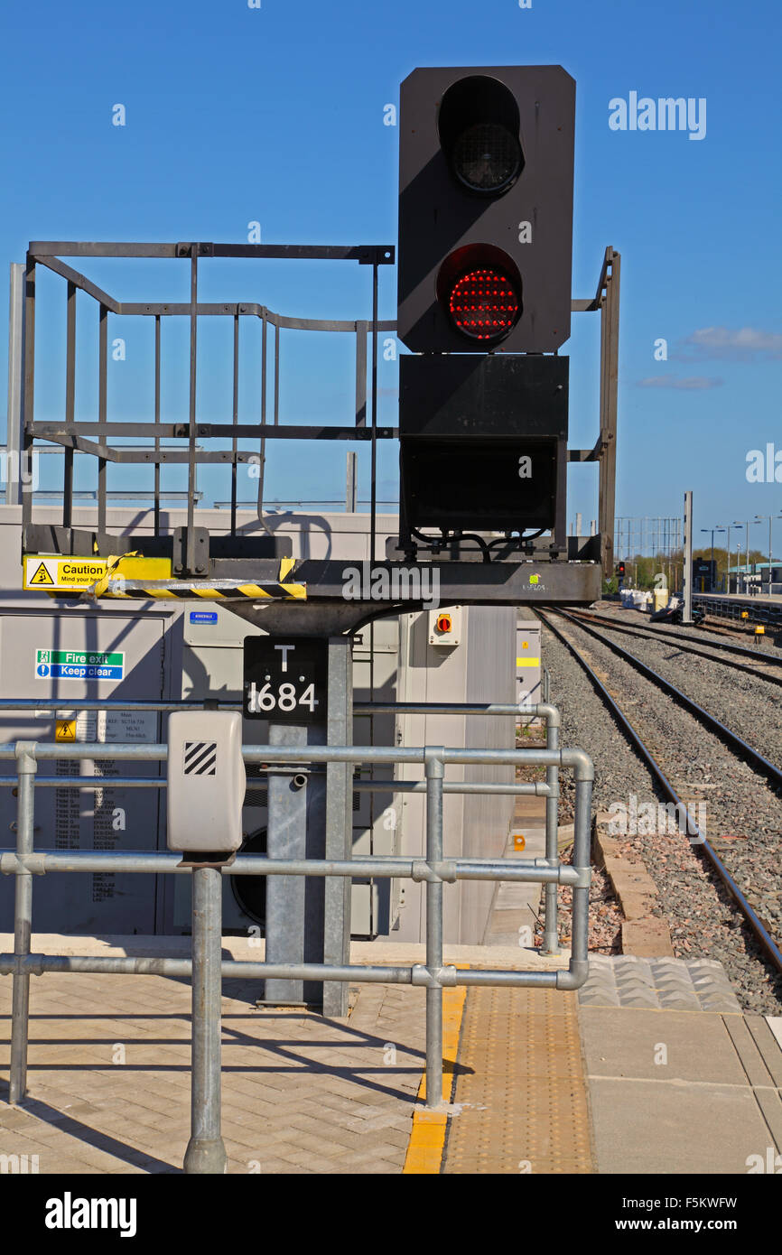 LED signal on platform showing a red aspect with identification plate ...