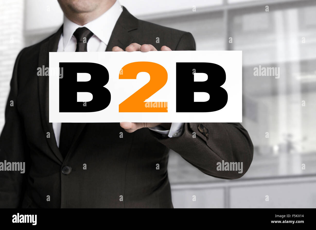 b2b sign is held by businessman concept Stock Photo - Alamy