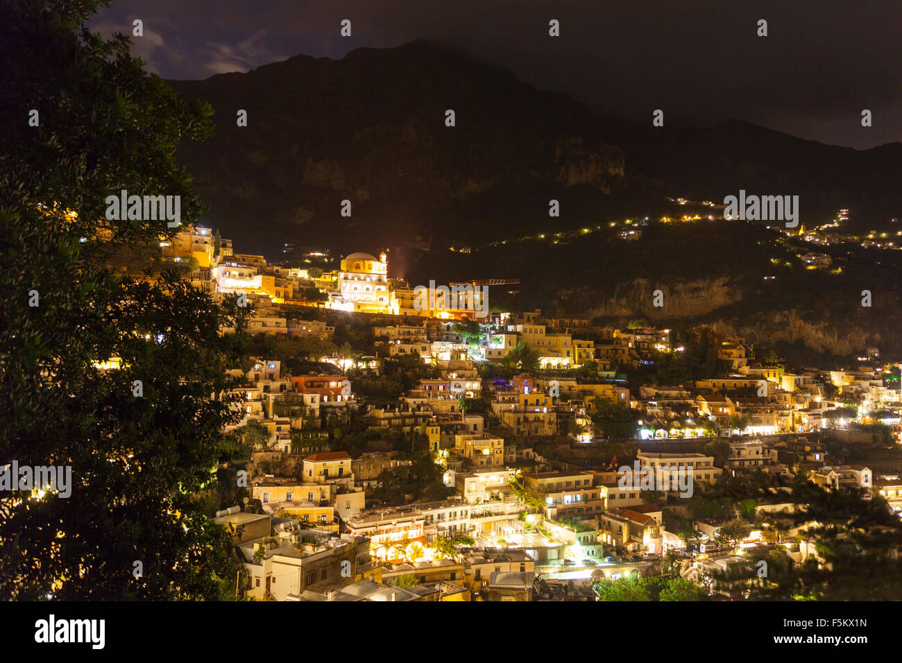 Night time panorama of Positano lights and the Amalfi Coast, Italy ...