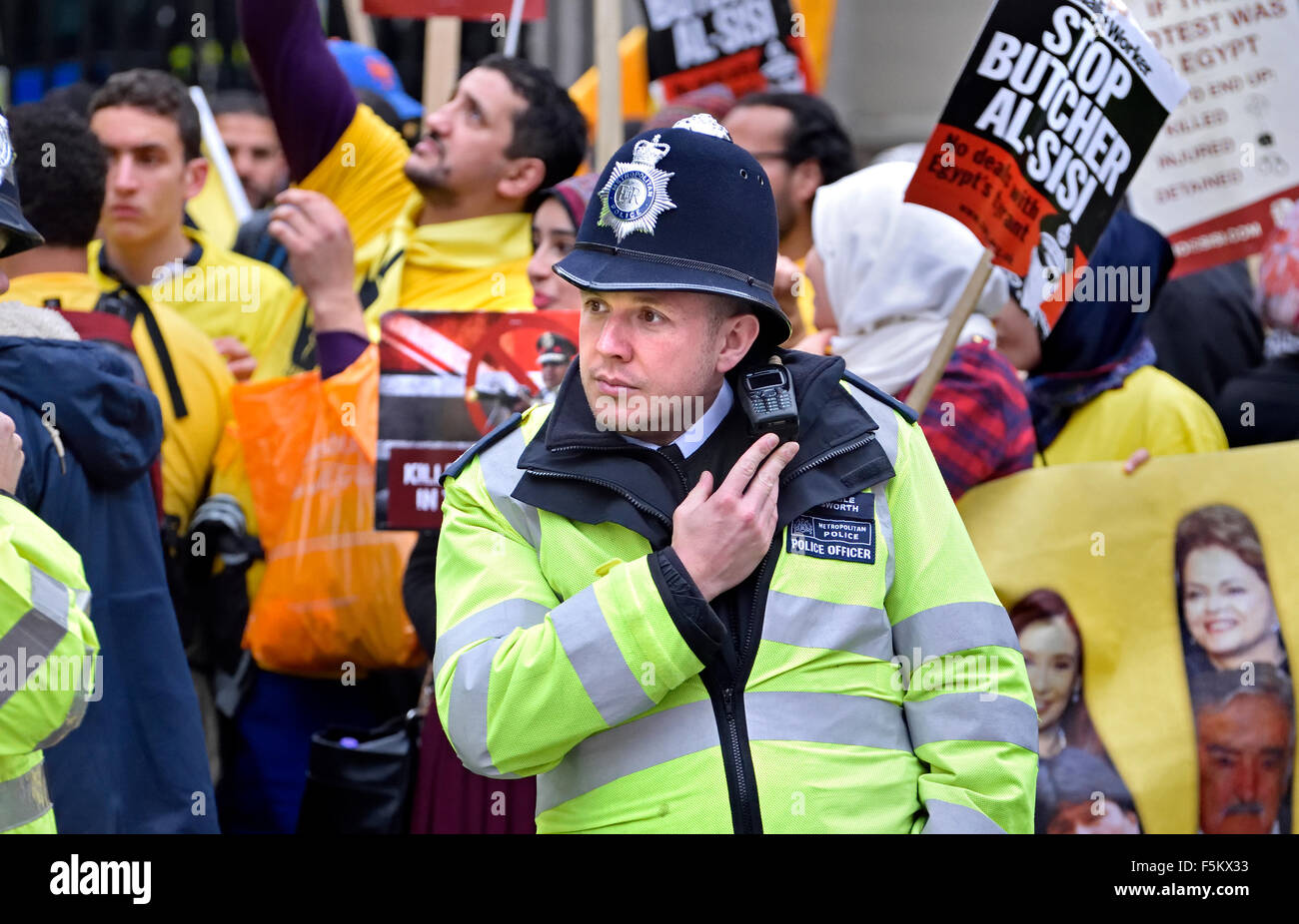 Metropolitan police officer communicating on his radio. London, Nov 5th ...