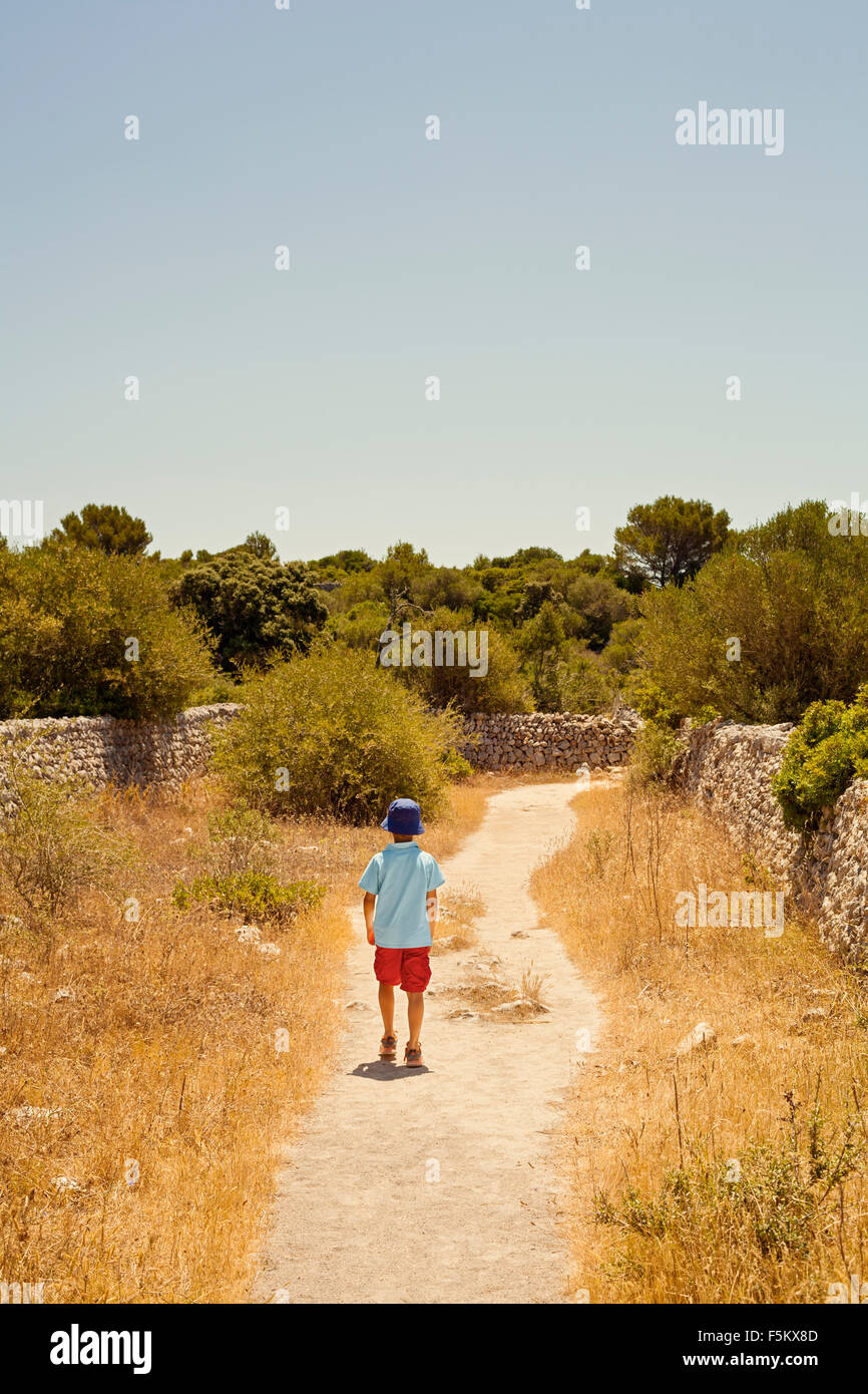Person walking down path hi-res stock photography and images - Alamy