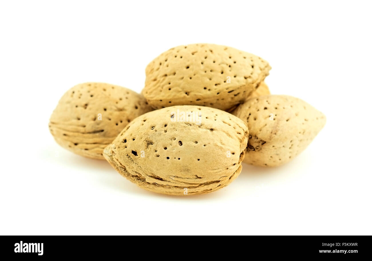 Pile of natural unshelled almond nuts against white background Stock ...