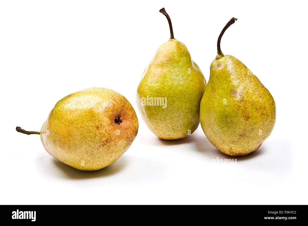 Three fresh green pears. Group of juicy ripe fruits. View of conference ...