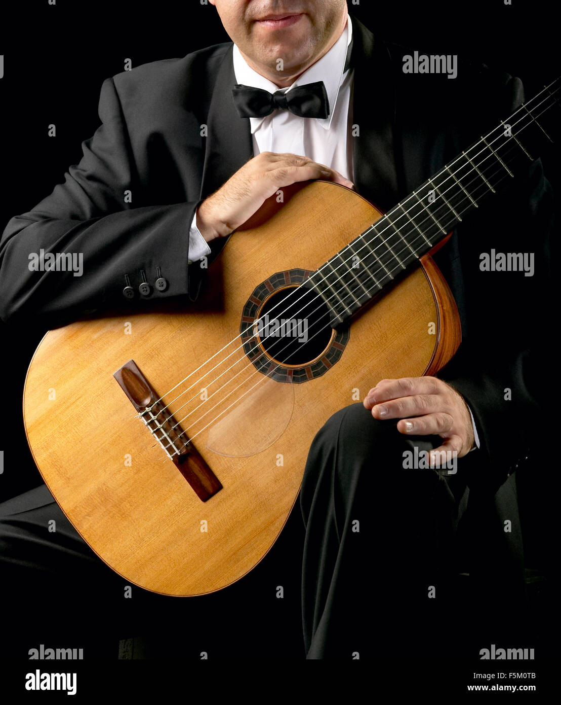 Classical Guitarist low key image square format Unrecognizable person ...