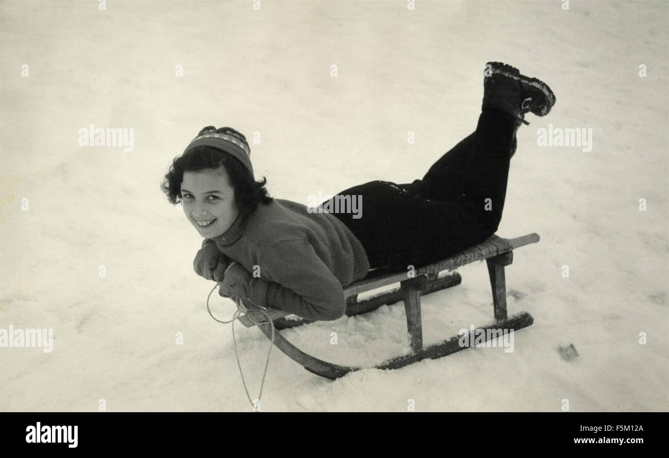 Sledding 1950s hi-res stock photography and images - Alamy