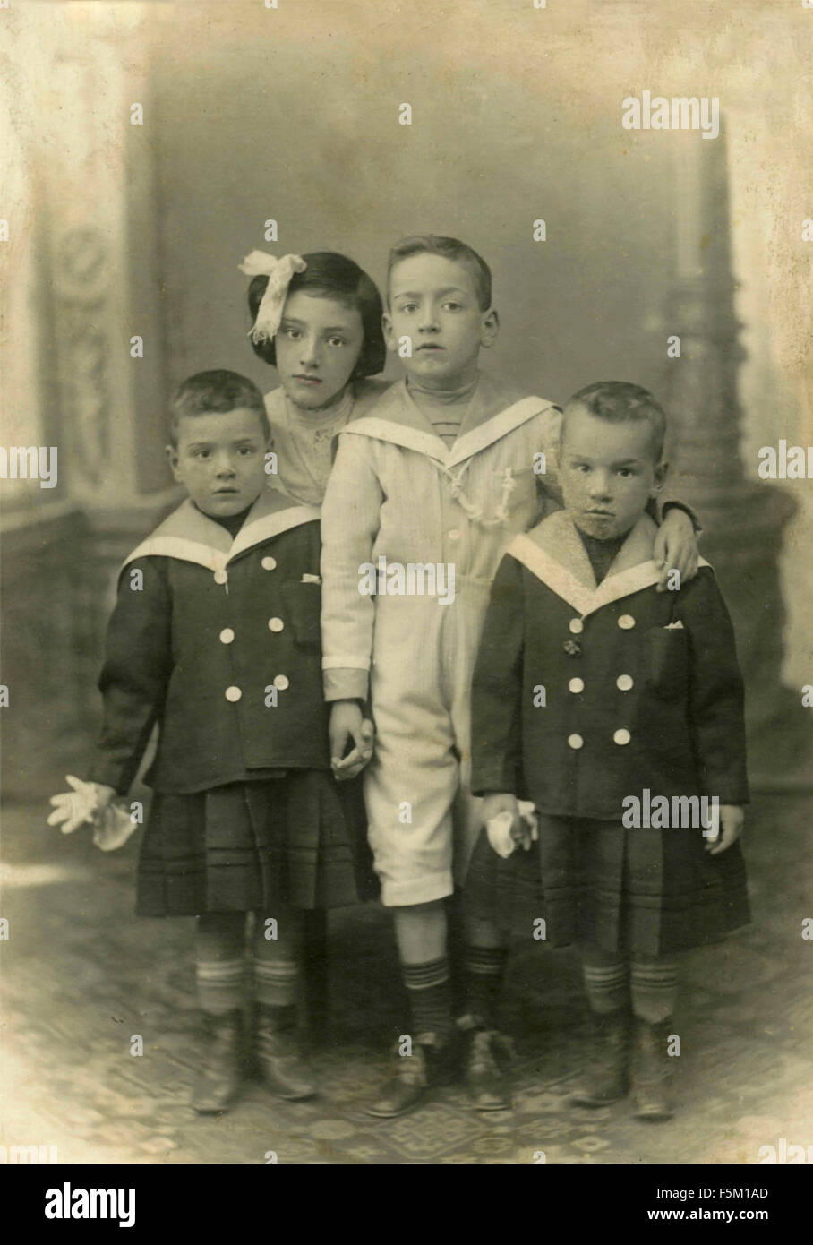 Four children, two dressed in sailor suits, Italy Stock Photo - Alamy