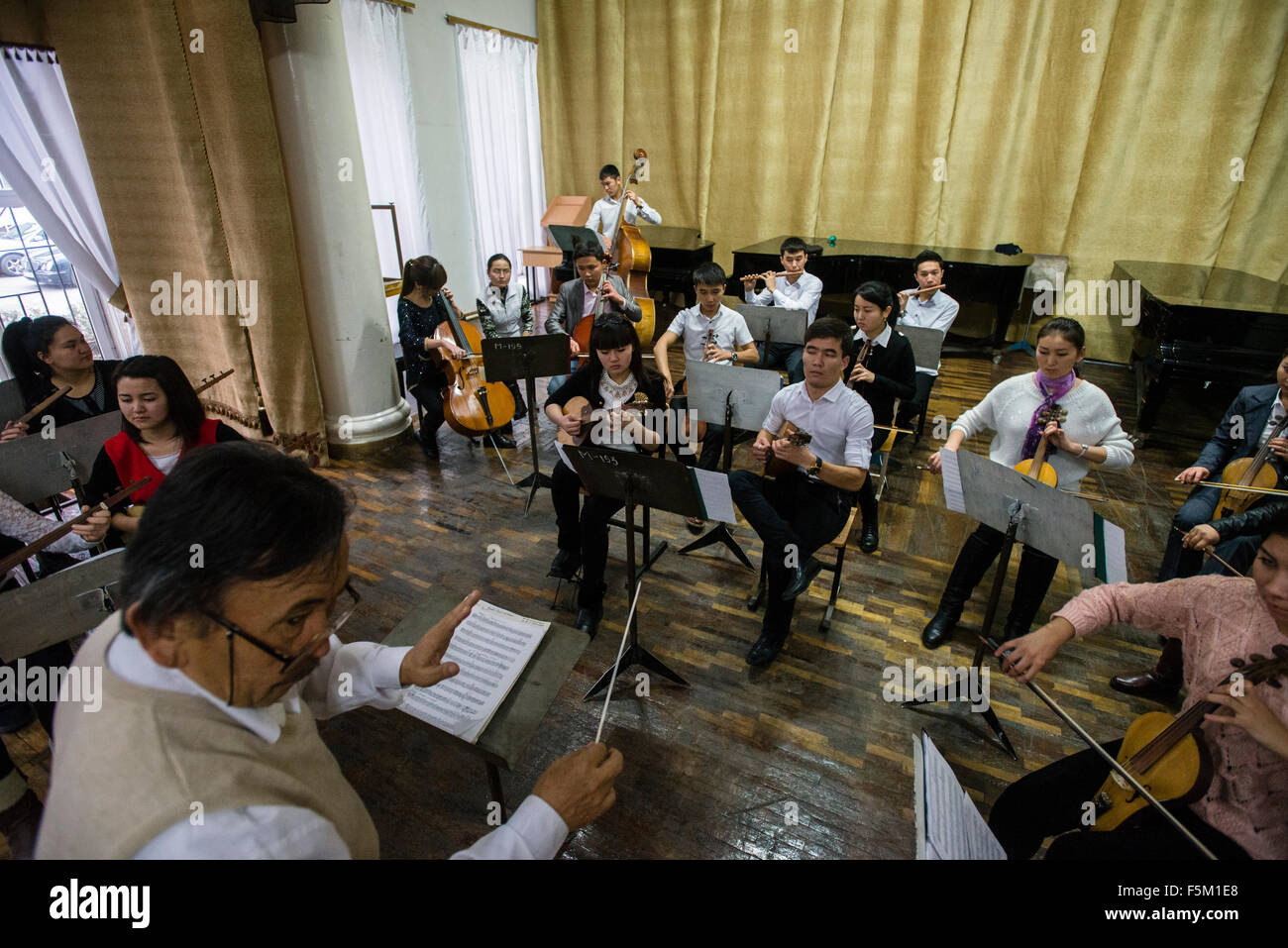 Kyrgyz authentic musical instruments orchestra play with conductor ...