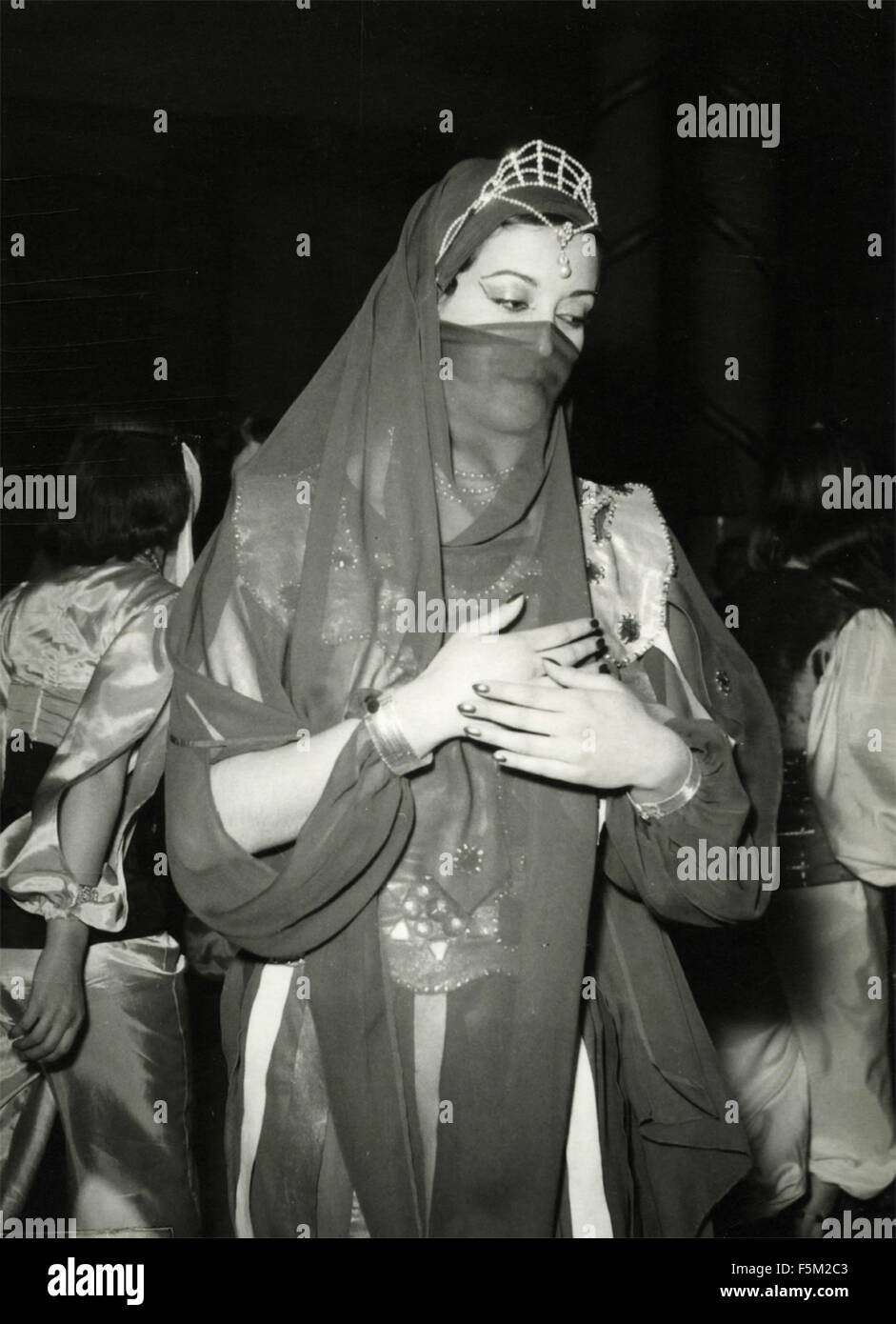 A girl at a masquerade ball dressed as odalisque, Italy Stock Photo - Alamy