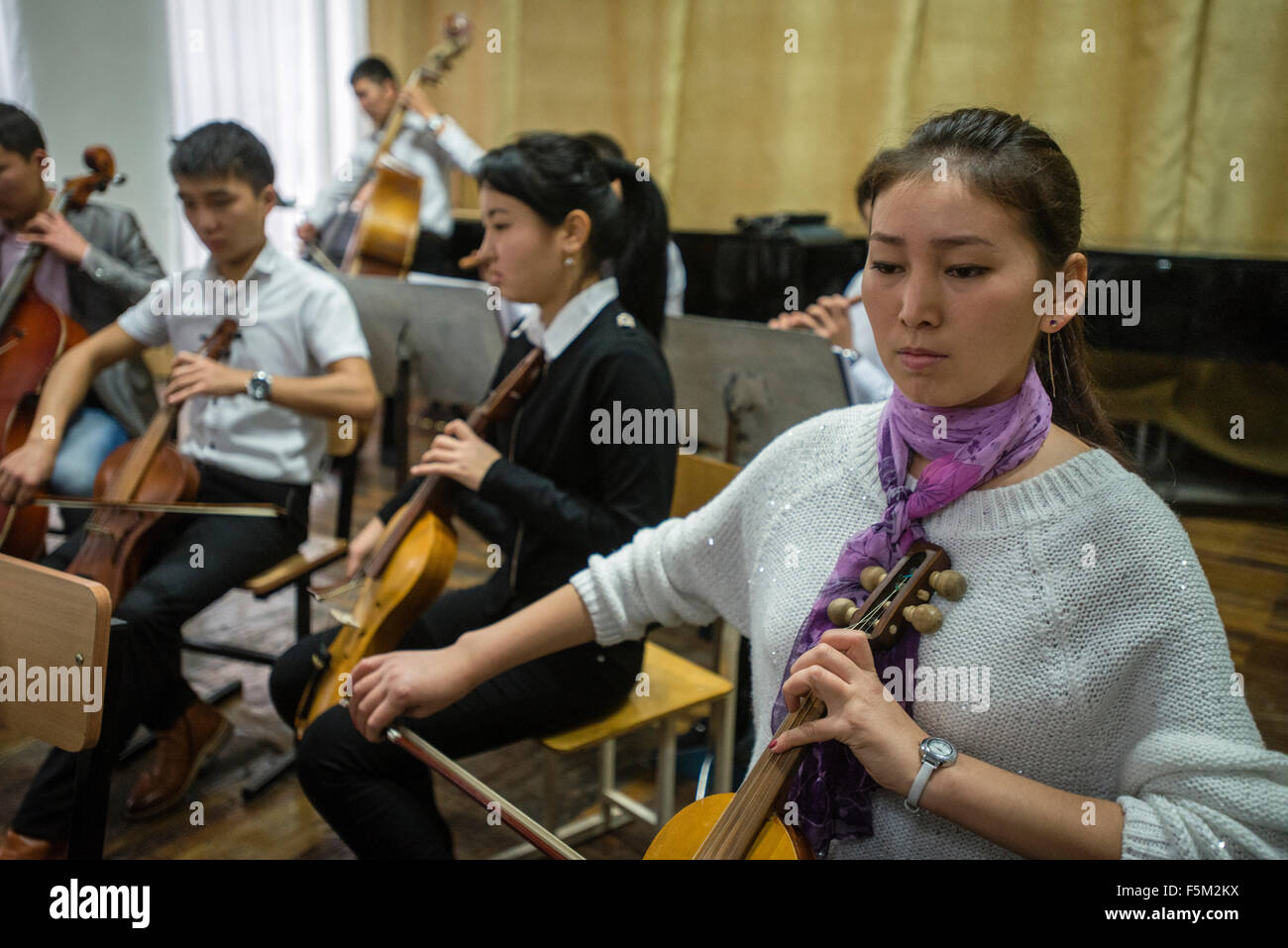 Kyrgyz authentic musical instruments orchestra play with conductor ...