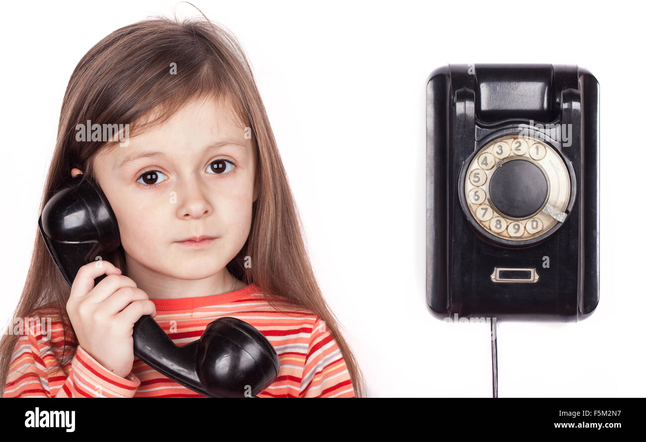 Serious child talking on phone isolated, white background Stock Photo ...