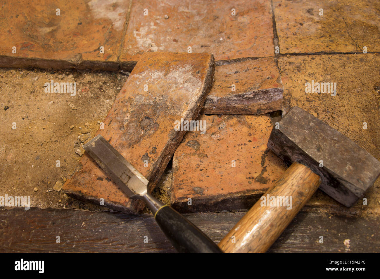 Broken clay flooring under repair Stock Photo - Alamy