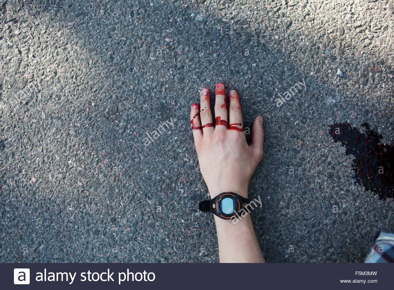 Injured hand with blood on road Stock Photo, Royalty Free Image ...