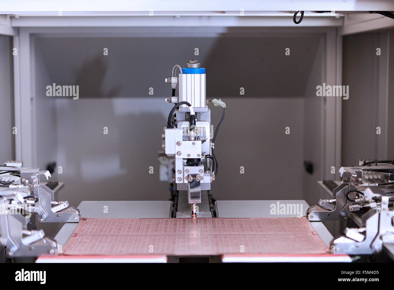 Cutting machine in flexible electronics plant cutting flexible circuits ...