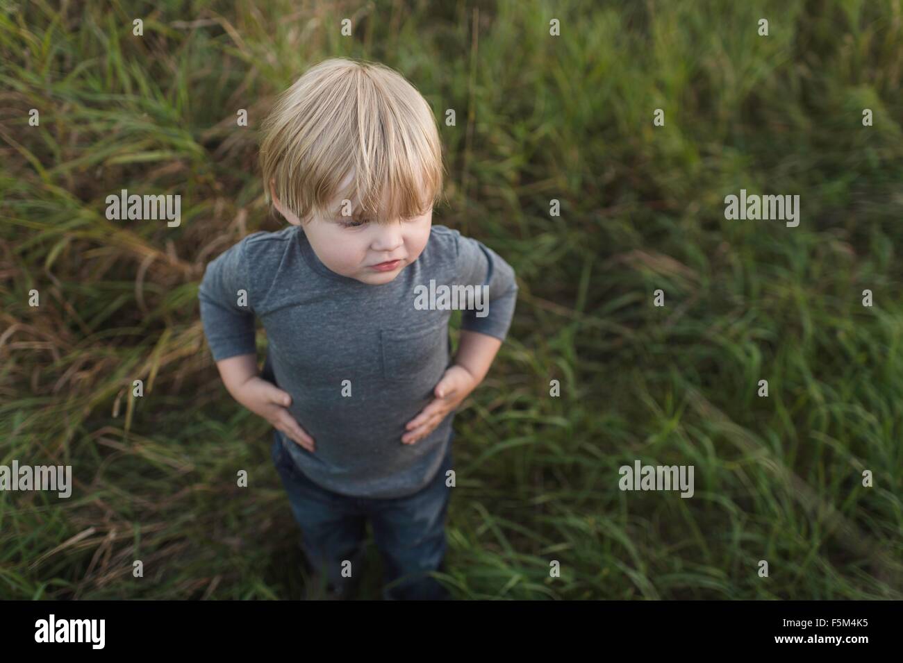 Boy standing hi-res stock photography and images - Alamy