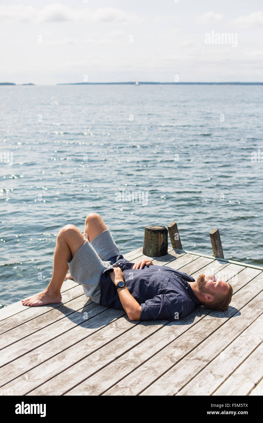 Male sunbathing on hi-res stock photography and images - Alamy