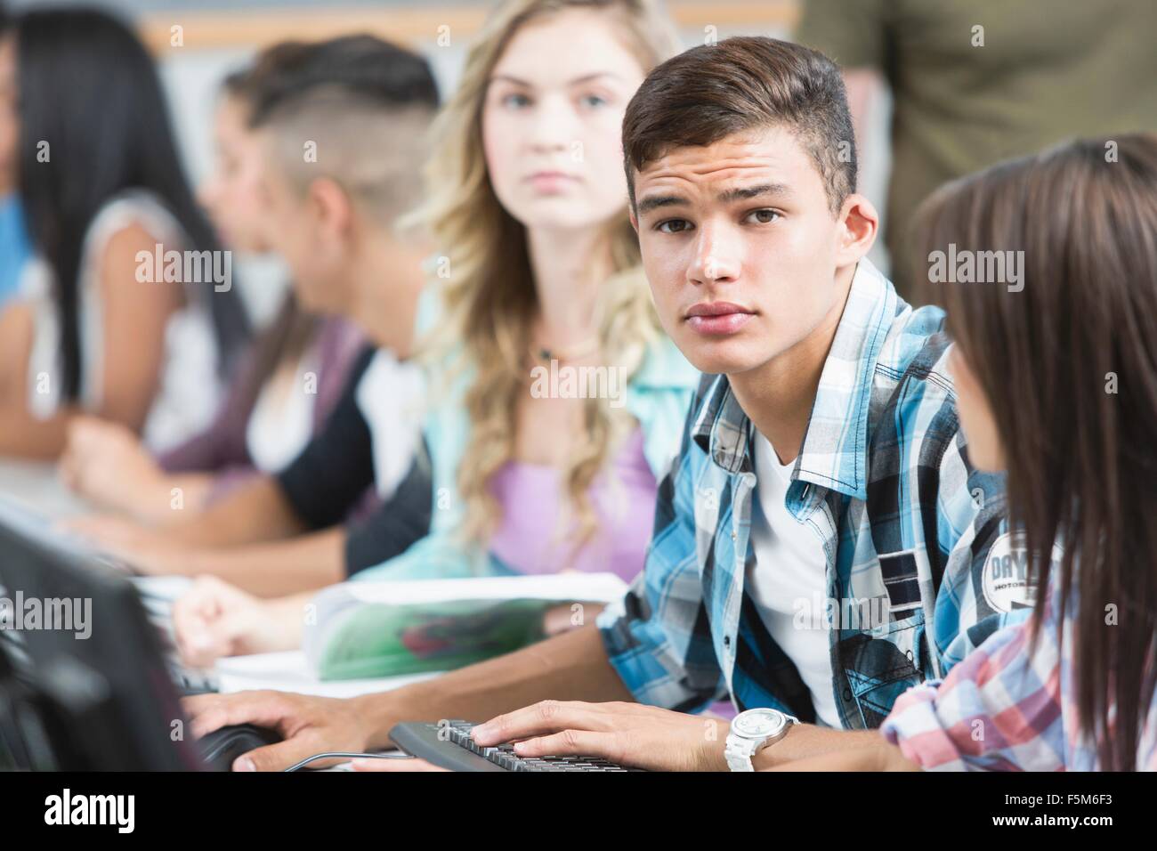 Row of high school students doing schoolwork Stock Photo - Alamy