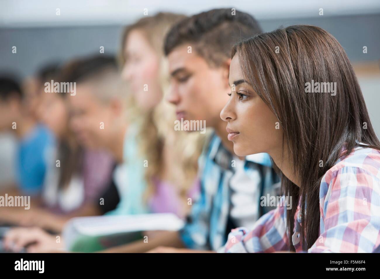 Row of teenage high school students working on computers Stock Photo ...