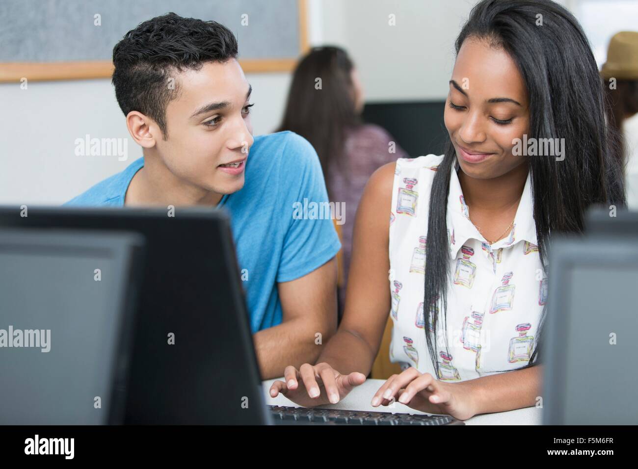 Two teenagers typing on computer in high school class Stock Photo - Alamy