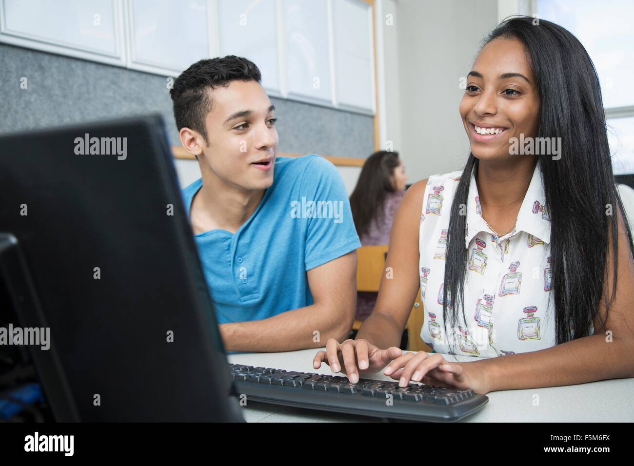 Two teenagers typing in high school computer class Stock Photo - Alamy