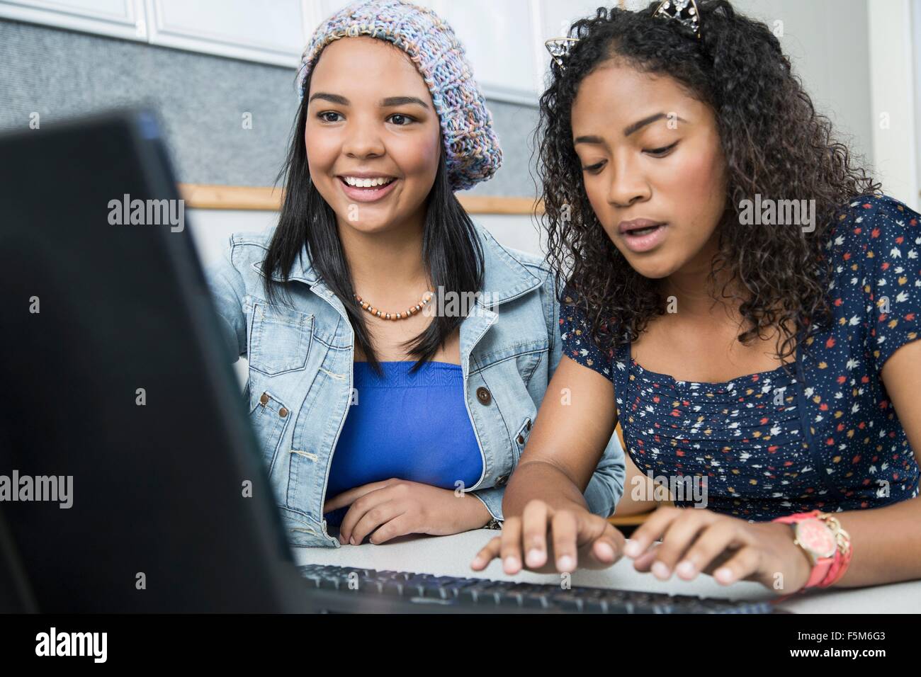 Two teenage girls in high school computer class Stock Photo - Alamy