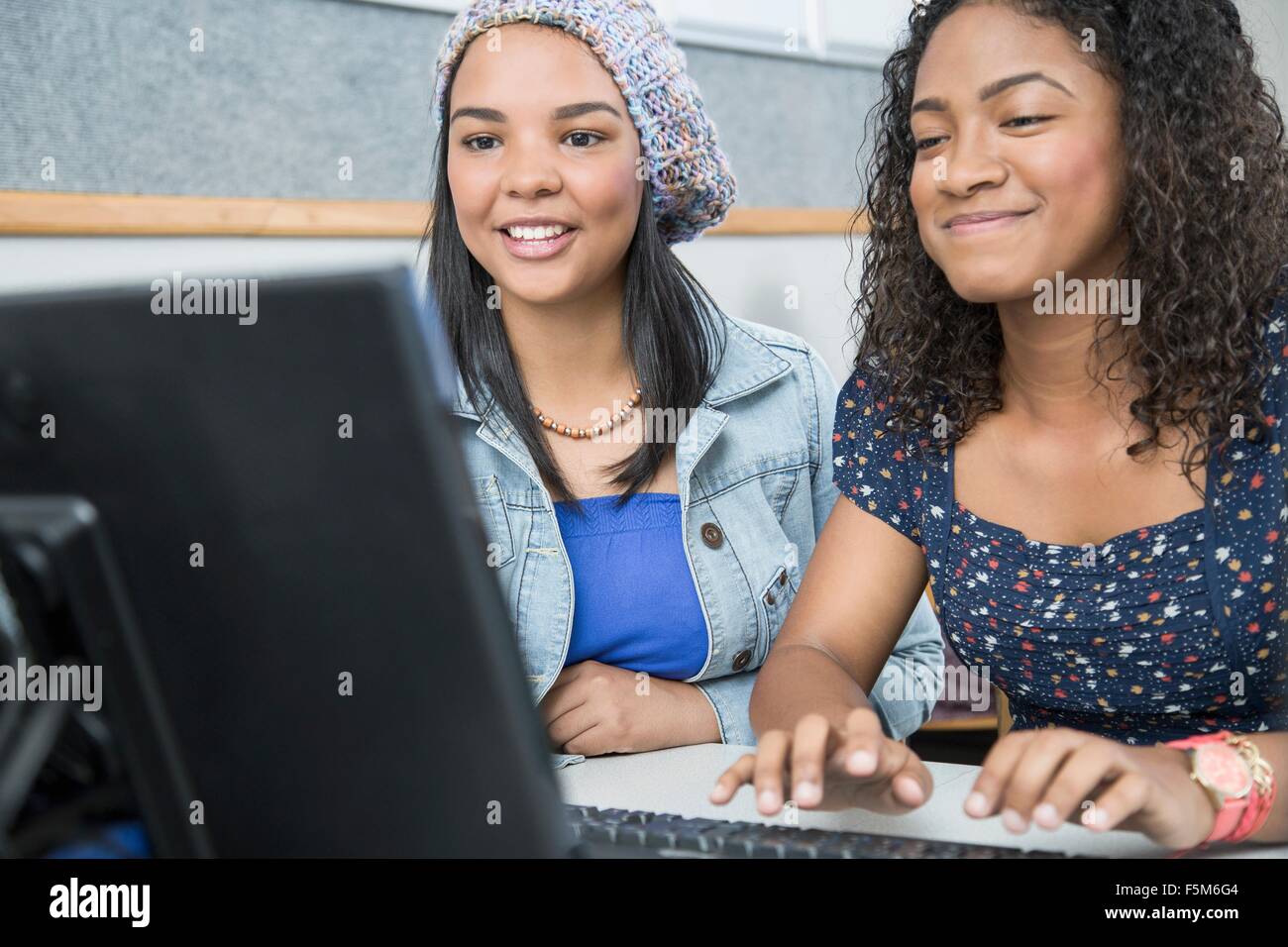 Girl, typing, classroom hi-res stock photography and images - Alamy