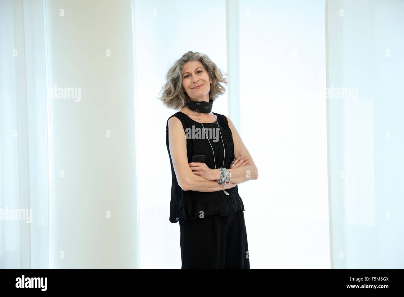 Portrait of stylish senior female designer in office Stock Photo - Alamy