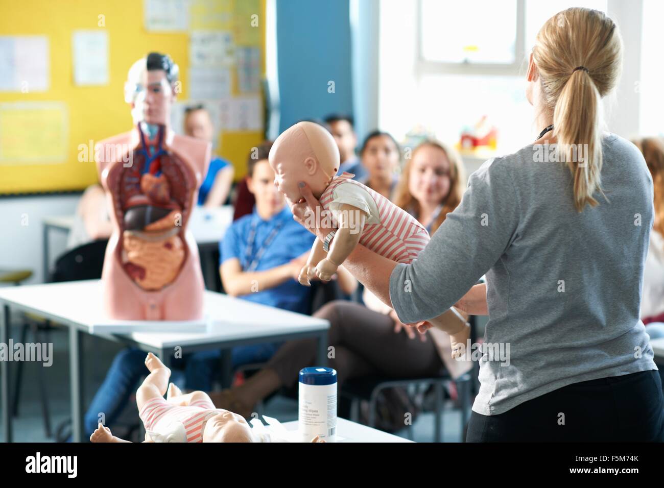 Lecturer speaking to college students in Childcare class Stock Photo ... Lecturer speaking to college students in Childcare class Stock Photo ...